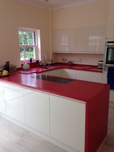 Royal Red Corian® Kitchen | Counter Production Ltd